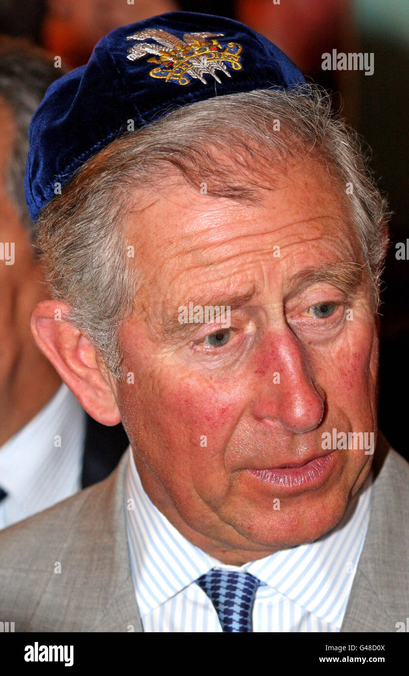 The Prince of Wales, wears a skull cap during a visit to the Danan ...