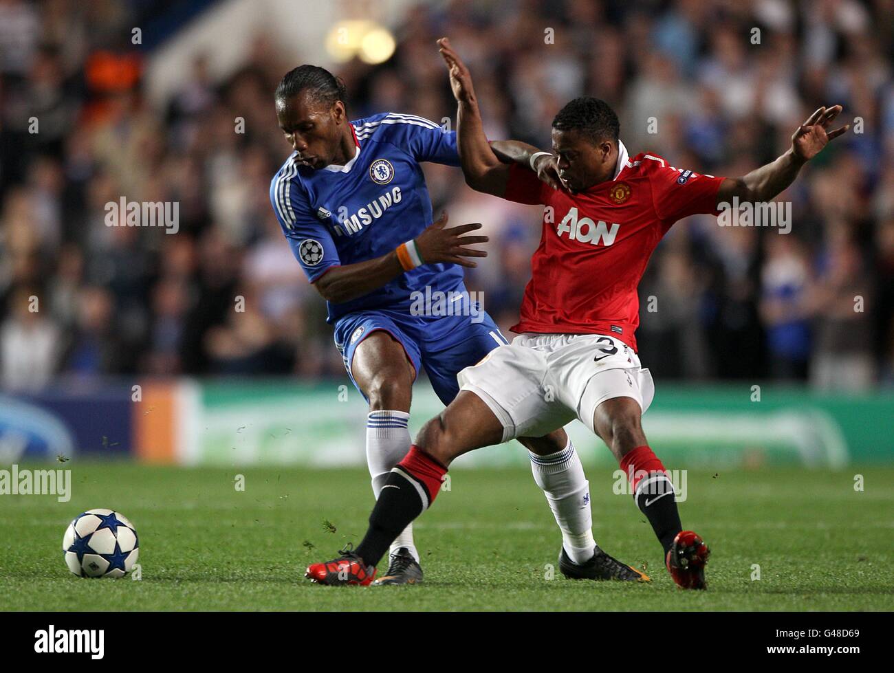 Chelsea's Didier Drogba (left) and Manchester United's Patrice Evra ...