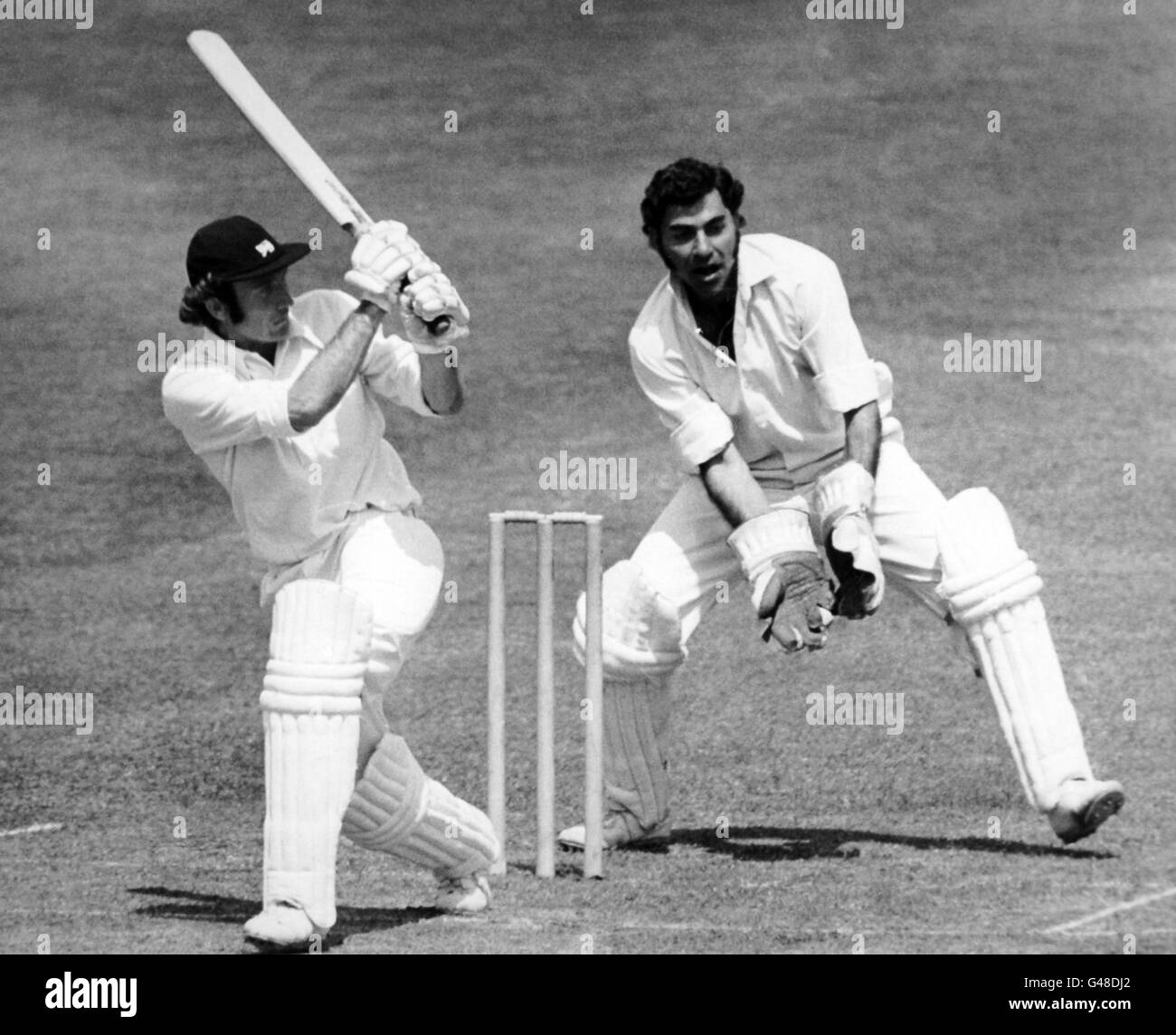Keith fletcher hits four off the bowling of abid ali hi-res stock ...