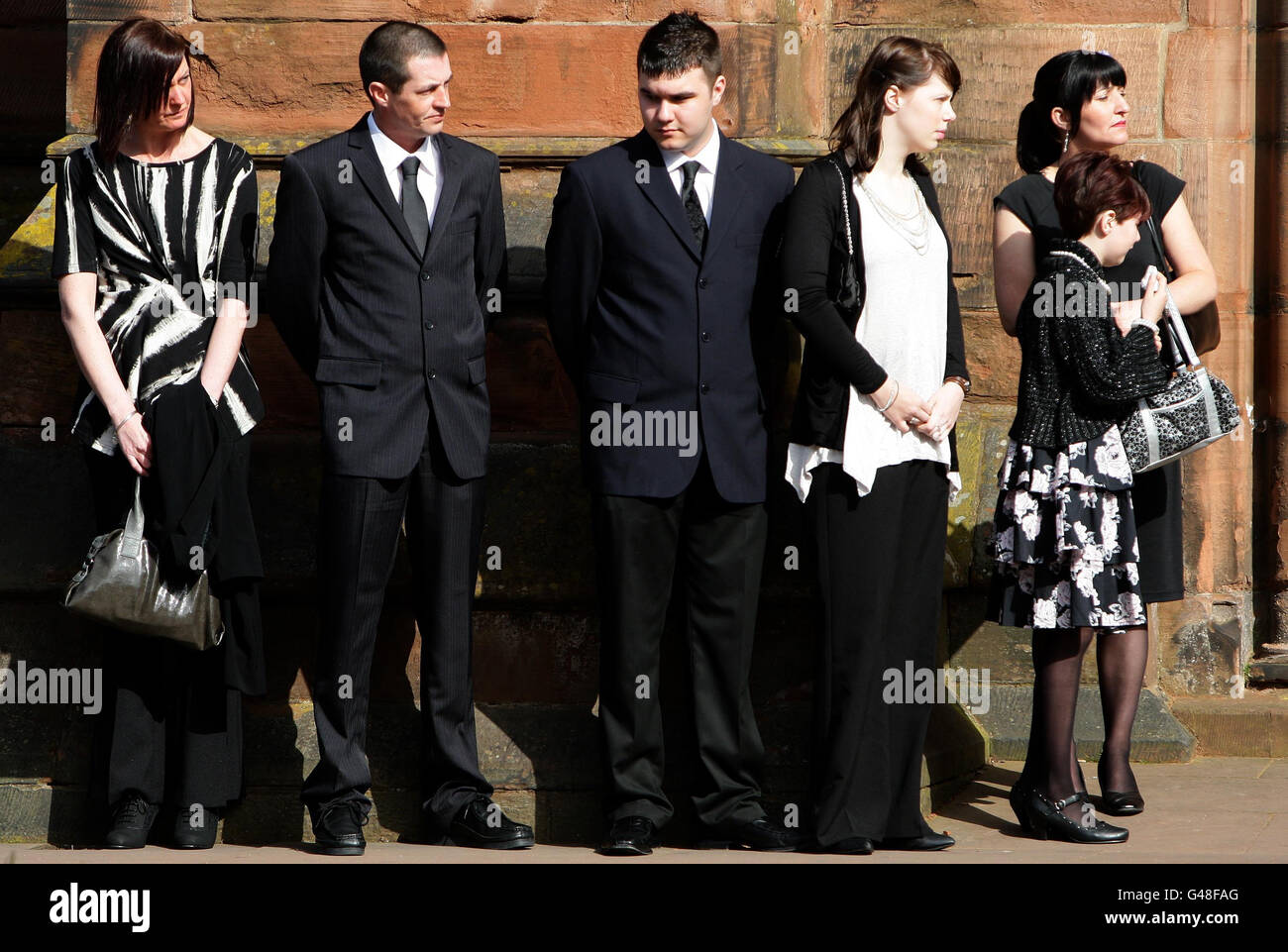 Family members look on as the coffin of Edward Stobart arrives for his ...