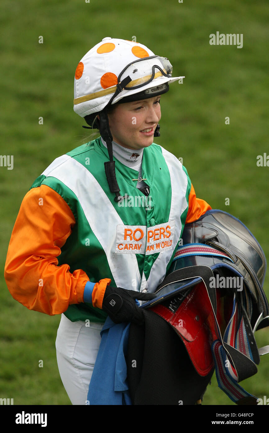 Jockey kelly harrison carries her saddle hi-res stock photography and ...