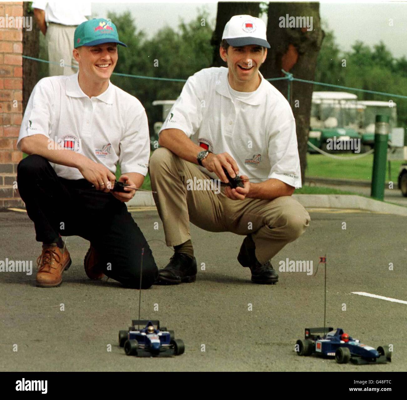 British Grand Prix drivers Damon Hill (right) and Johnny Herbert brush ...