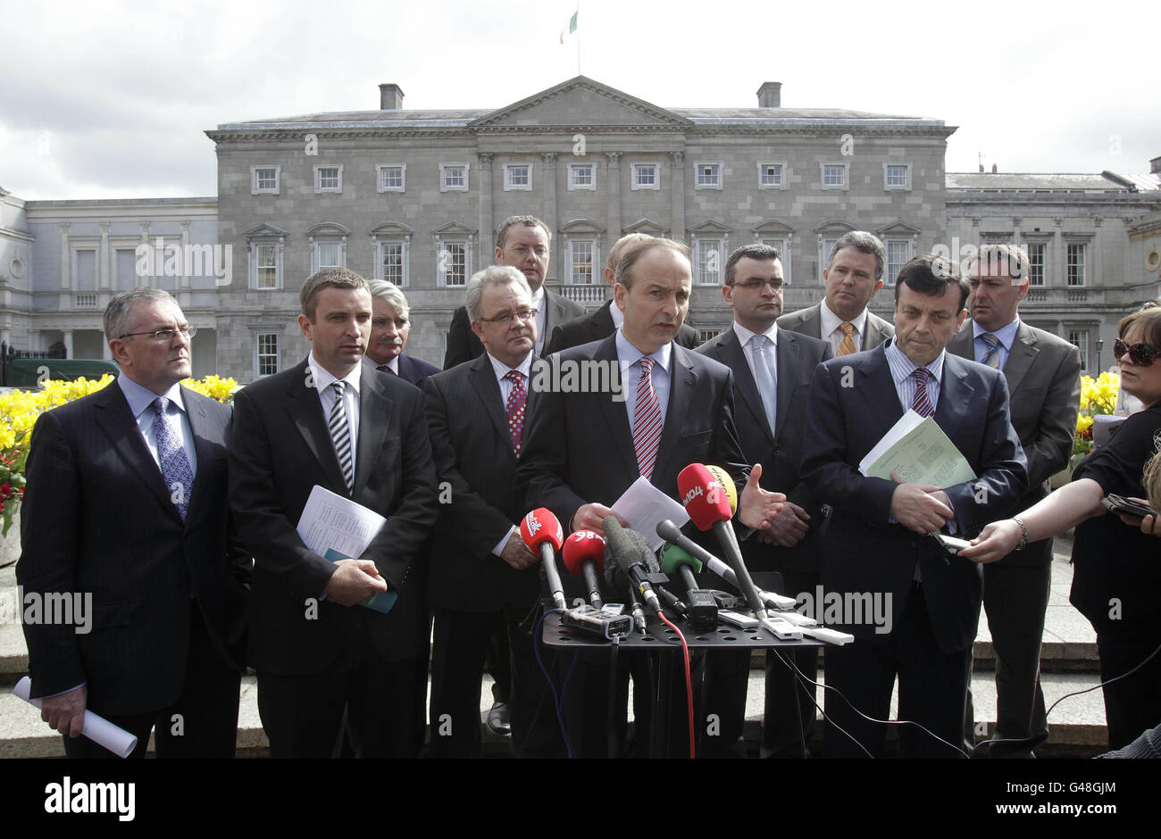 Fianna Fail leader Micheal Martin (centre) unveils the party's new ...