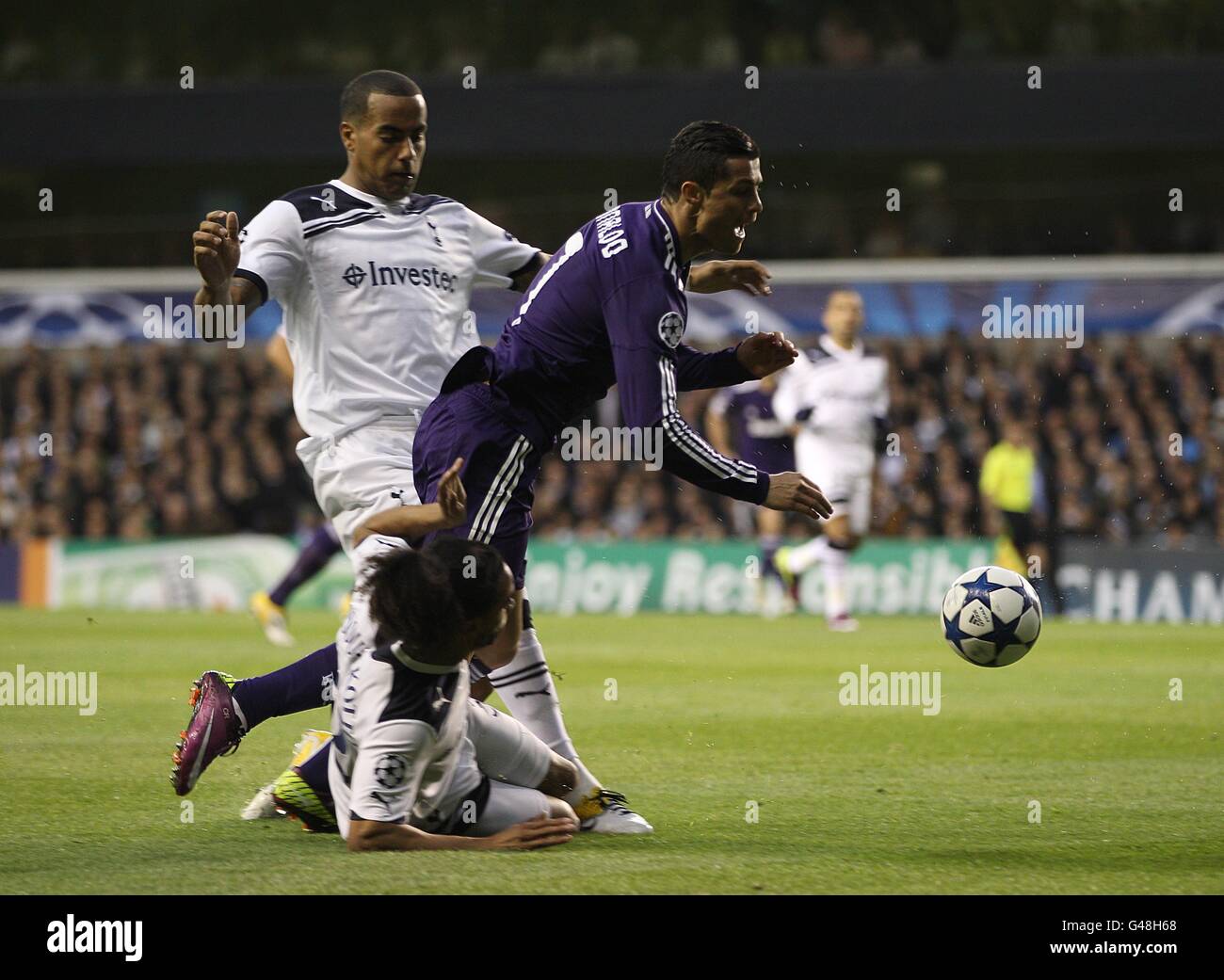 Real Madrid's Cristiano Ronaldo goes down under the tackle from ...