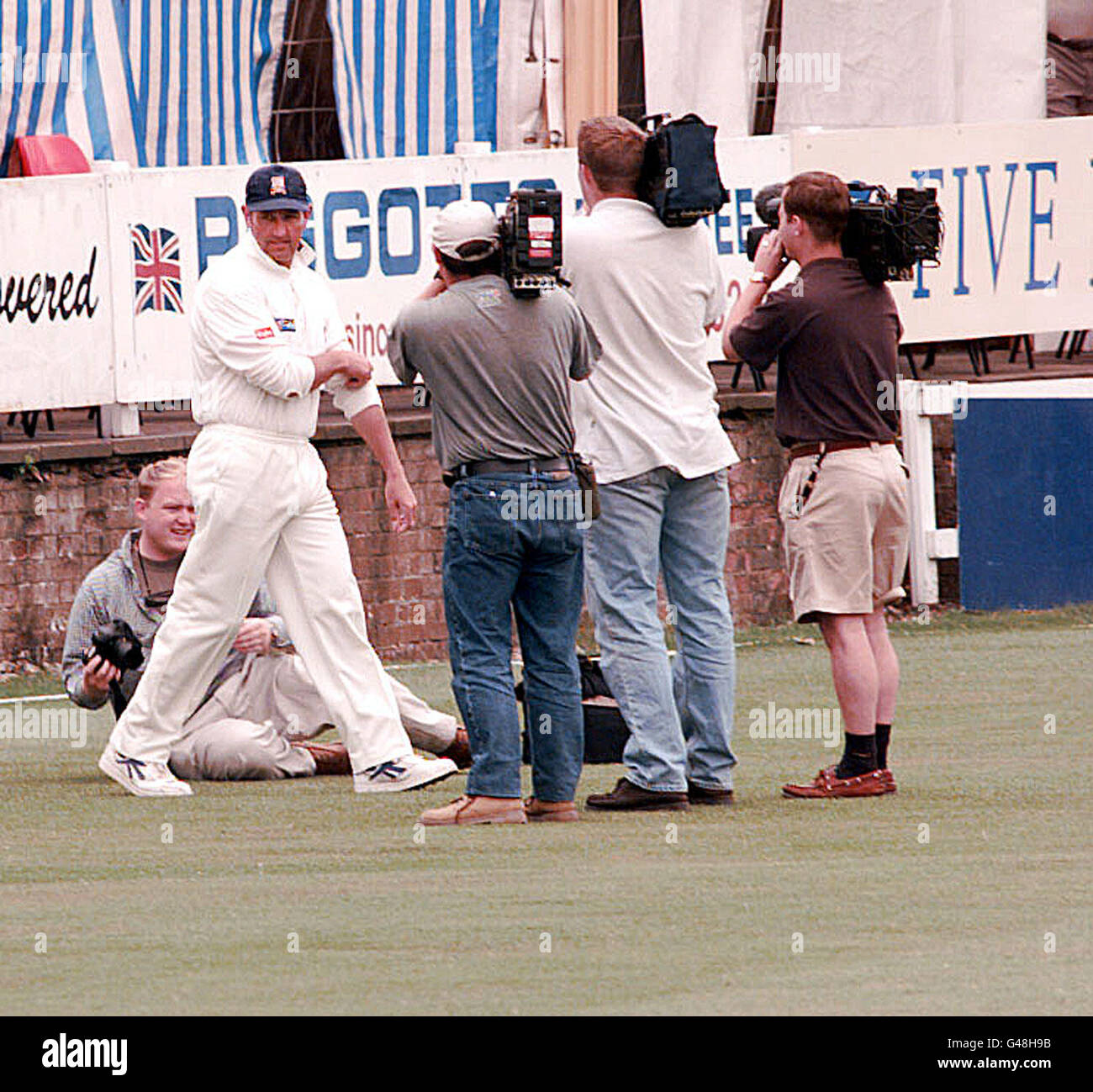 Graham Gooch attracts media attention as he walks onto the field for ...