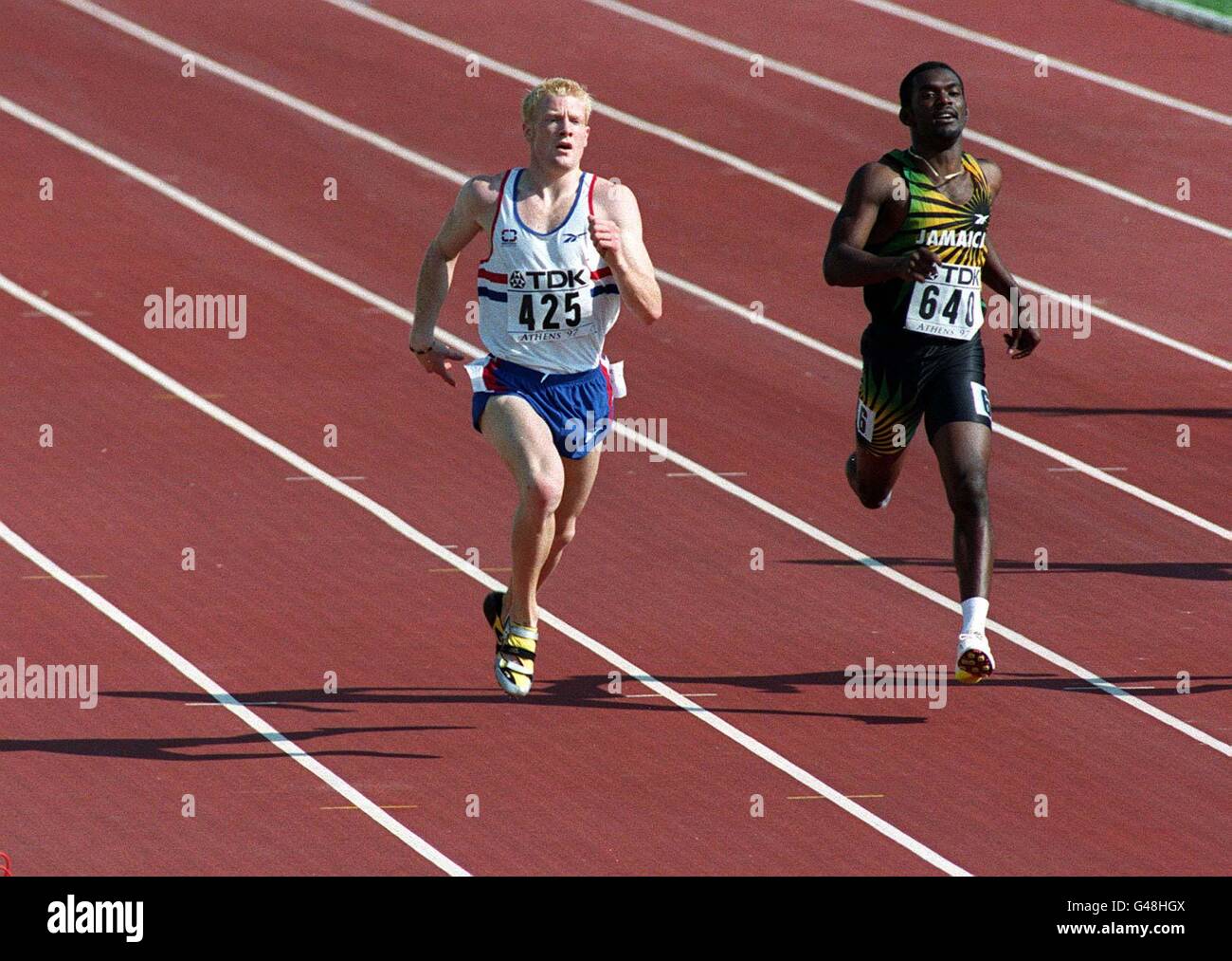 Iwan Thomas (left) of Great Britain coasts home for an easy win in the ...
