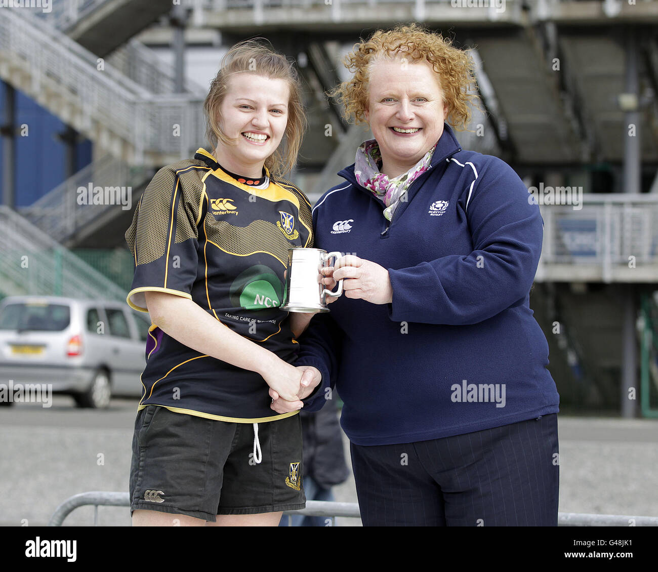 Cartha Queens Park's Louise Moore (left) receives the player of the ...
