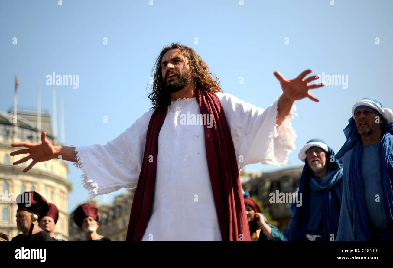 An actor playing the part of Jesus addresses the crowd during an open ...