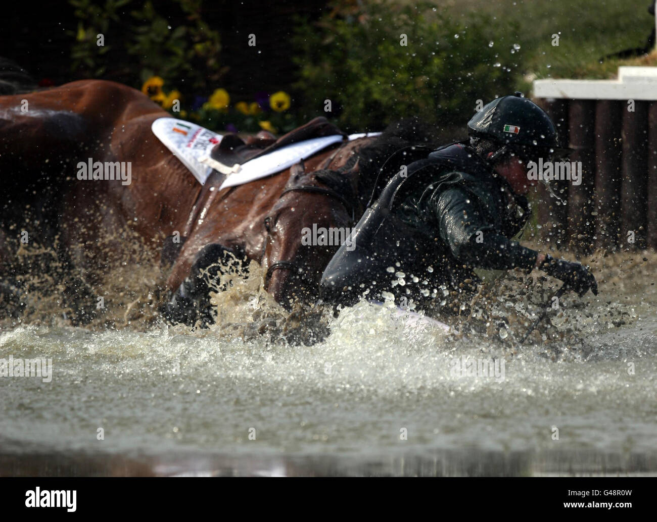 Ireland's Sarah Wardell riding Killeenduff Boy falls in the lake as she ...