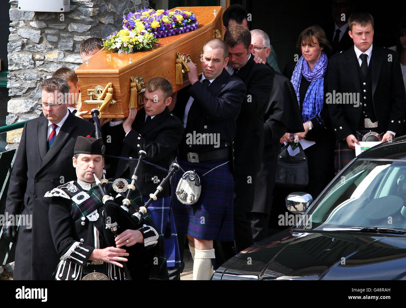 Katie Taylor and her son David (right) follow the coffin of Sophie ...