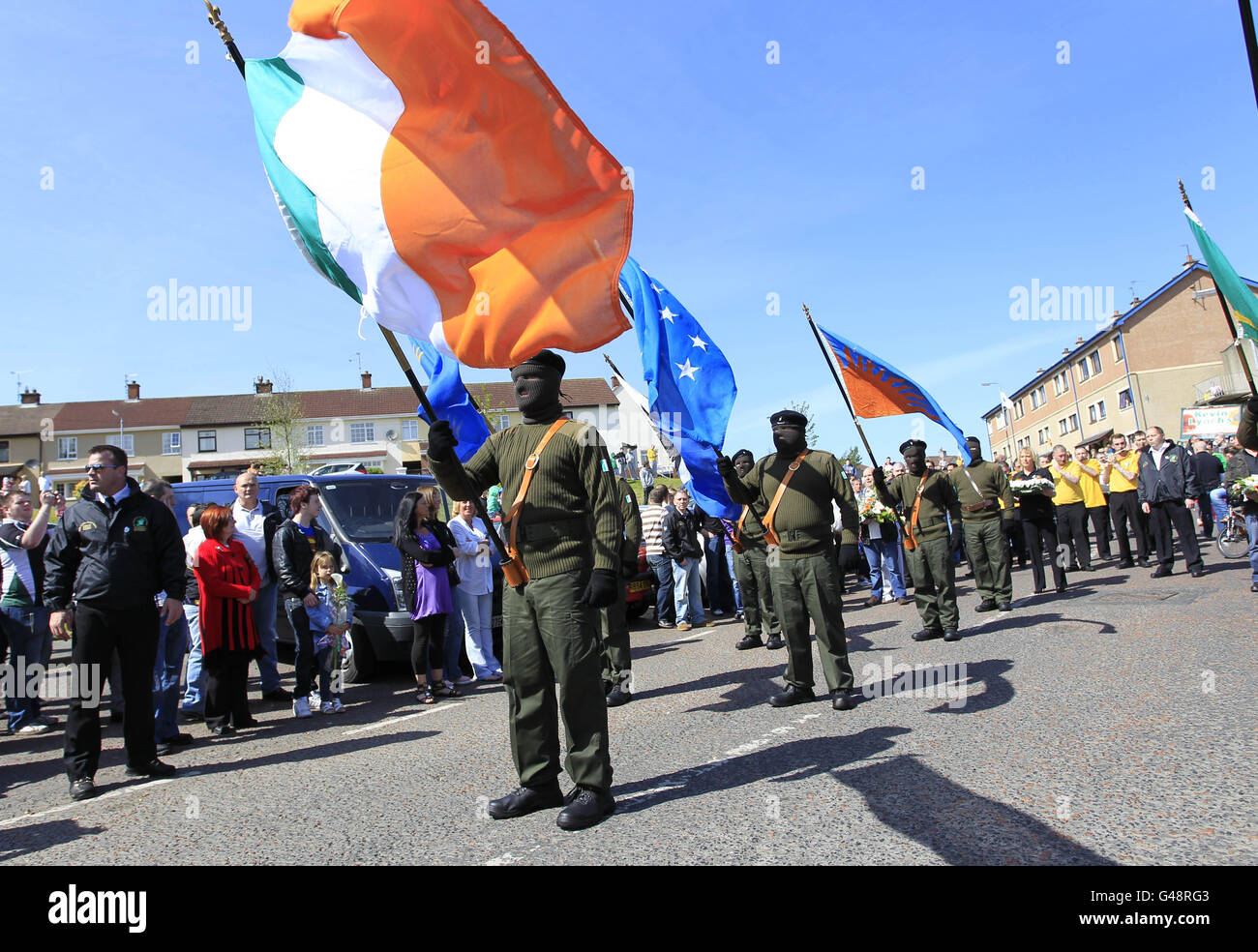 Members of the Real Irish Republican Army (RIRA) terror group parade ...