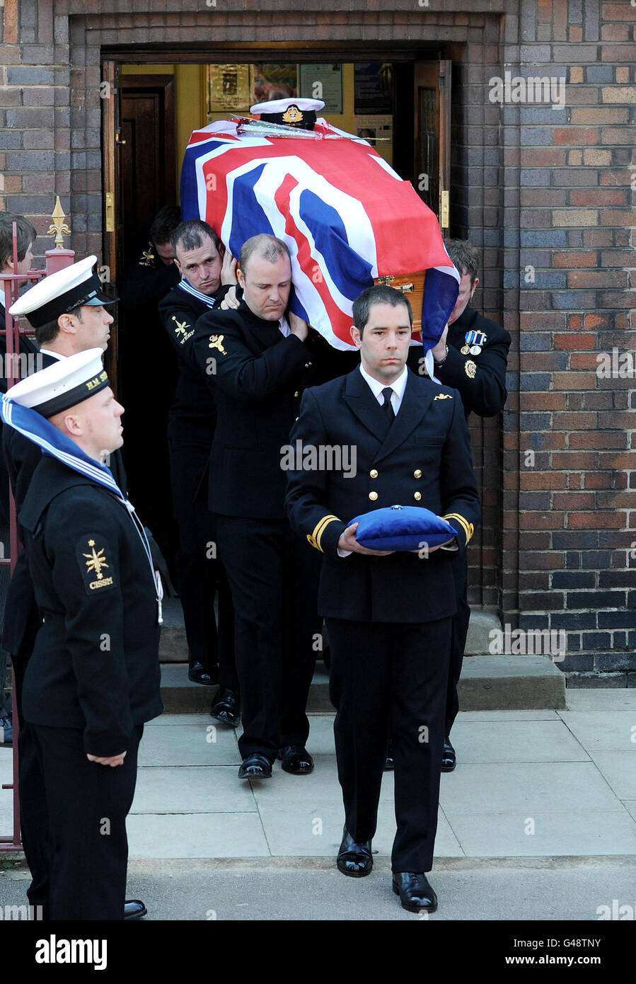 The coffin of Lieutenant Commander Ian Molyneux is carried from the ...
