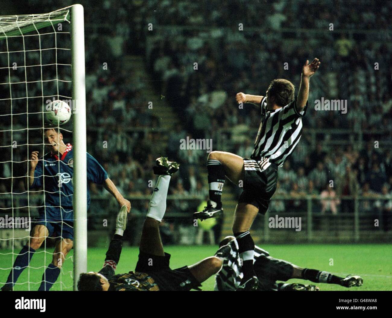 Newcastle's John Beresford (right) scores his second goal to put ...