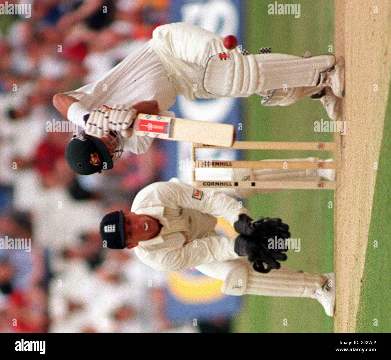 England wicket-keeper Alec Stewart looks on as Australia's Greg Blewett ...