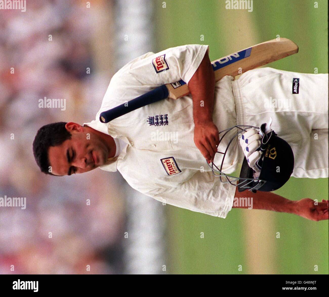 A disappointed Adam Hollioake bites his lip as he leaves the pitch ...