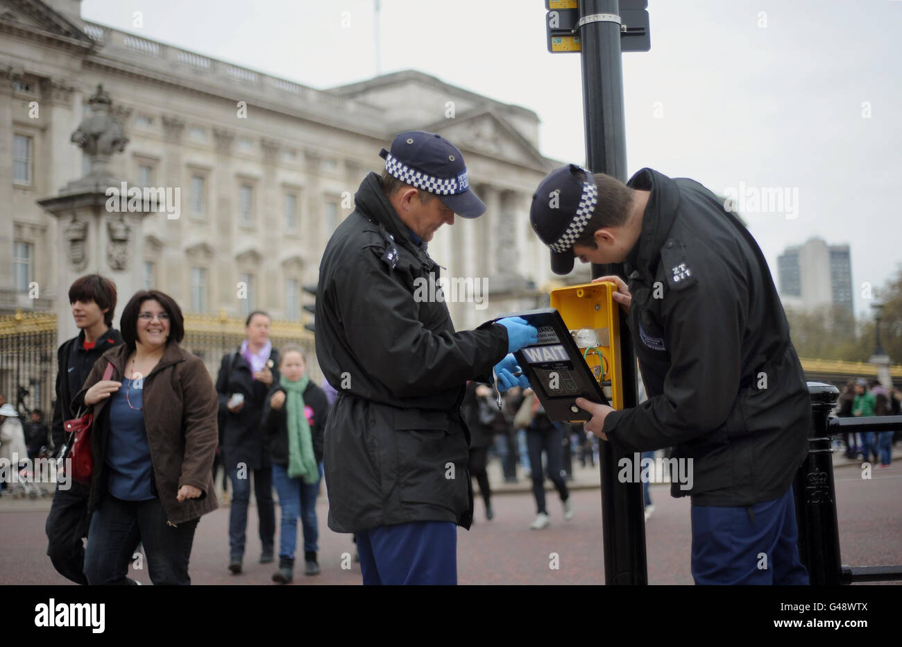 Metropolitan police officers carry out security checks on drains and ...