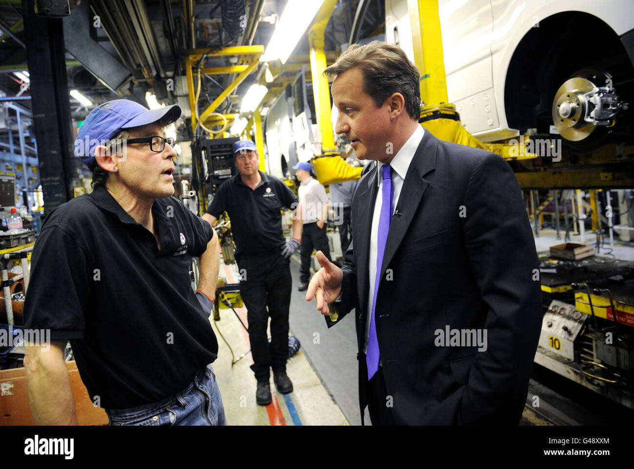 Britain's Prime Minister David Cameron meets workers at the General ...