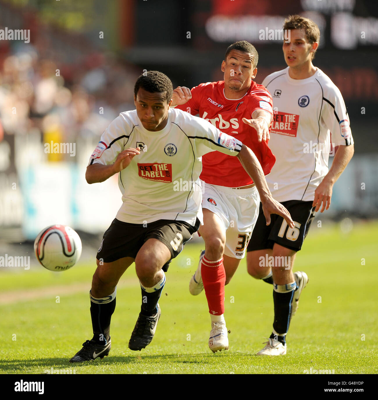 Charlton's Nathan Eccleston (centre) challenges Rochdale's Joe ...
