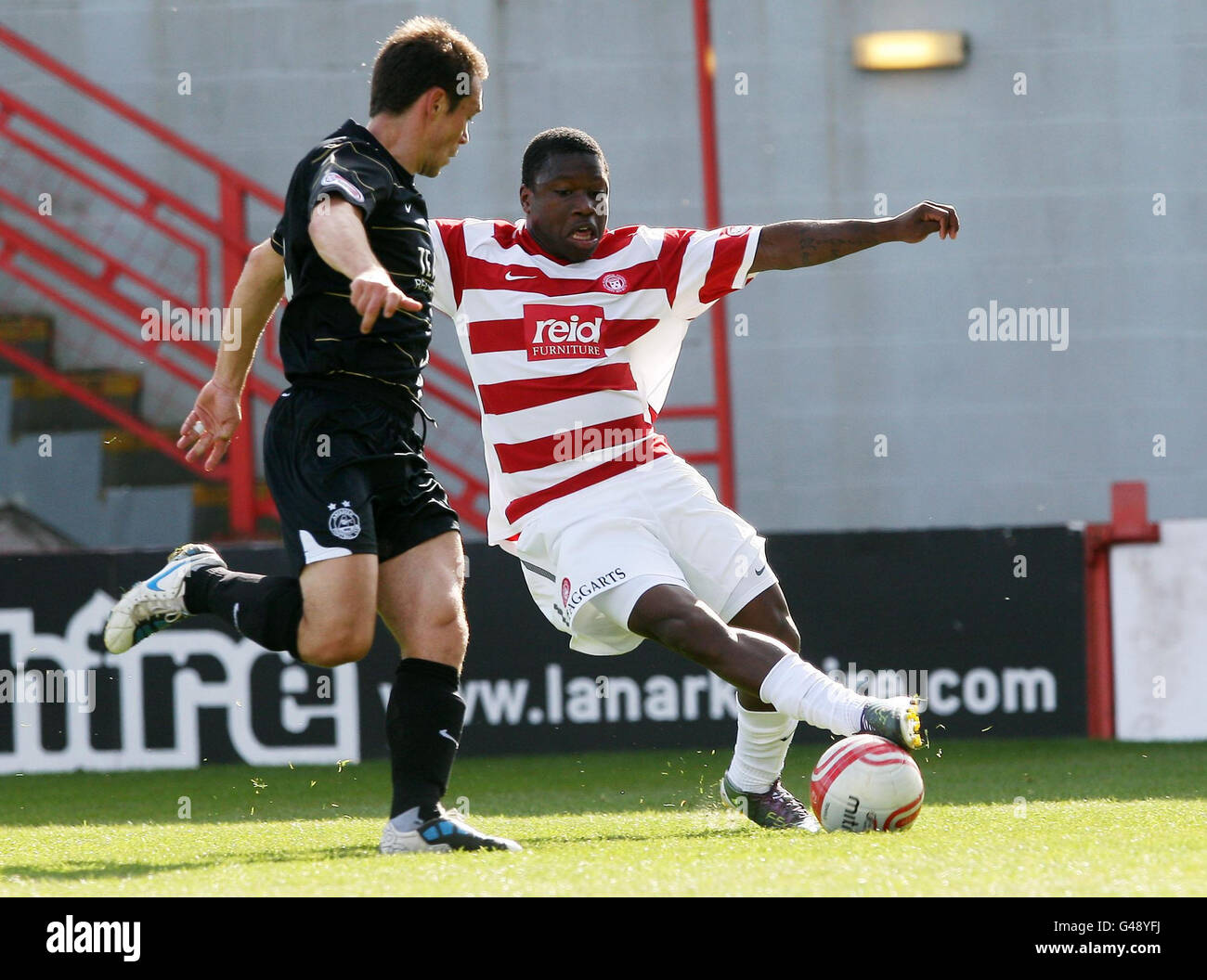 Hamilton Academical's Alex Neil holds off Aberdeen's Zander Diamond ...