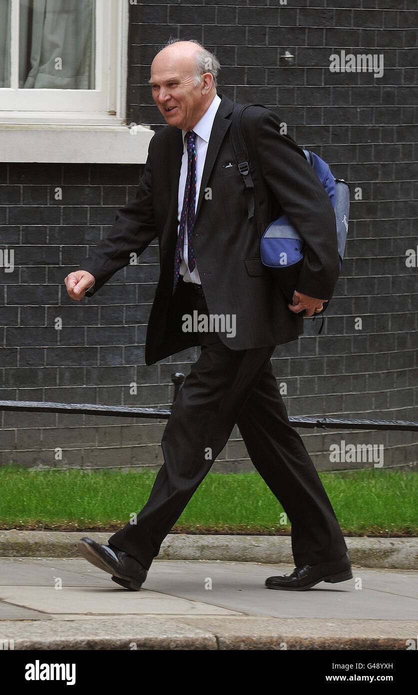 Business Secretary Vince Cable arrives in Downing Street in London, for ...