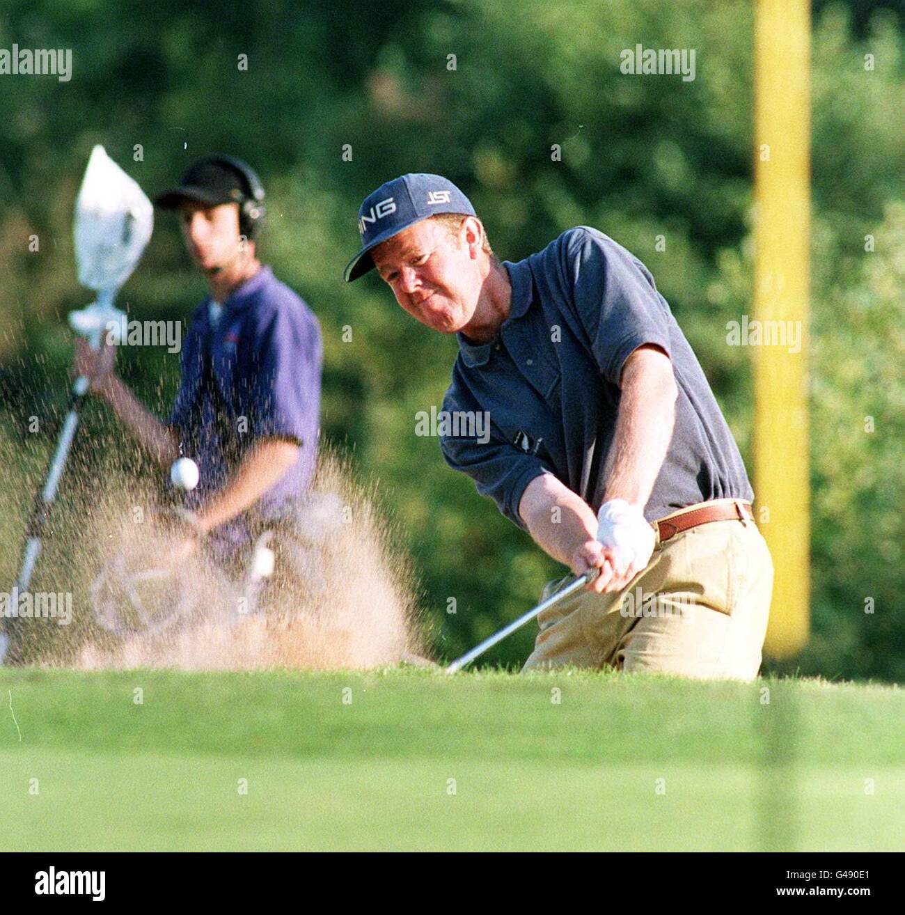 New Zealand's Greg Turner chips out of the bunker on the 18th to win ...