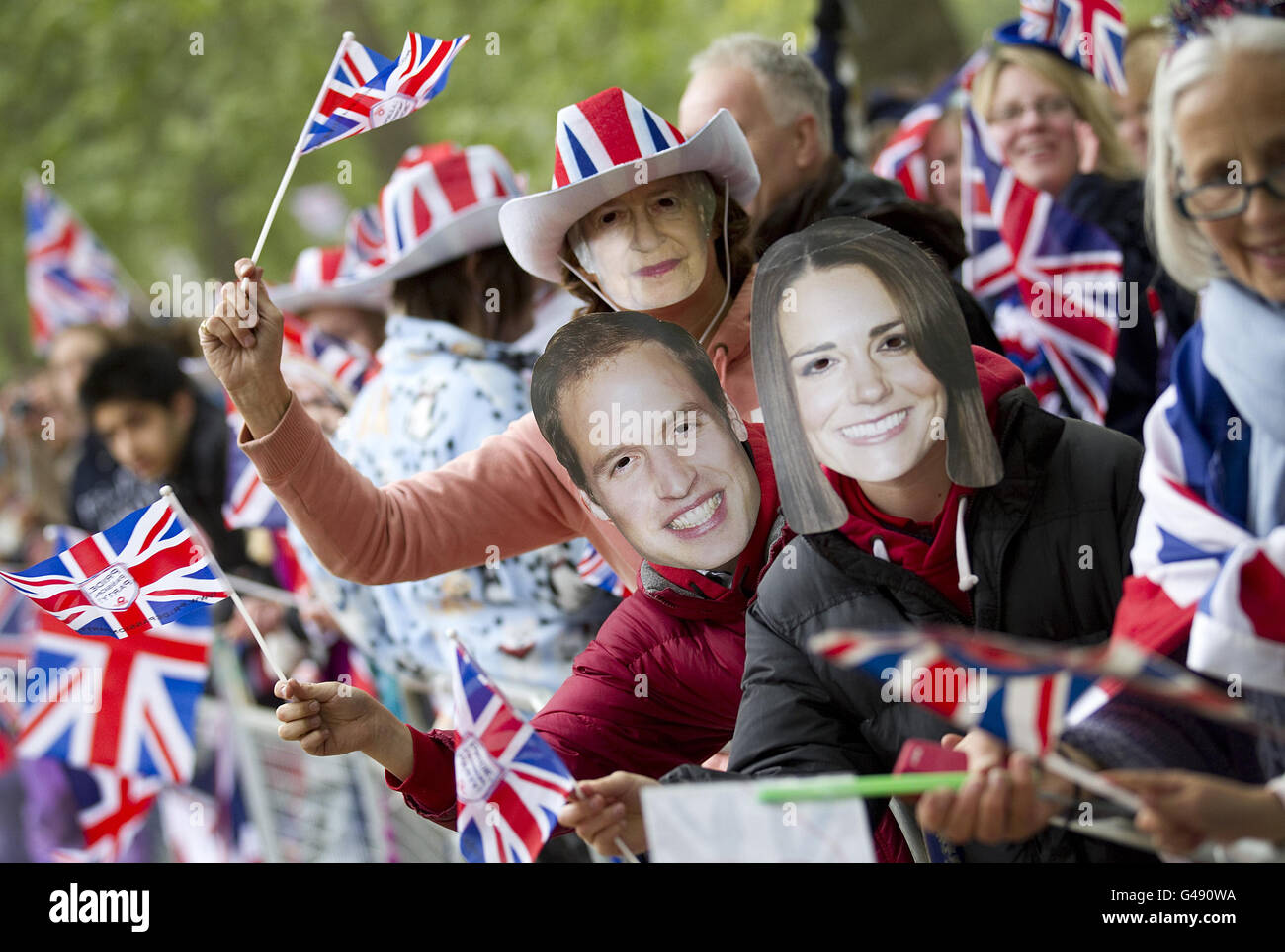 Royal enthusiasts wear masks of Queen Elizabeth II, Prince William and ...