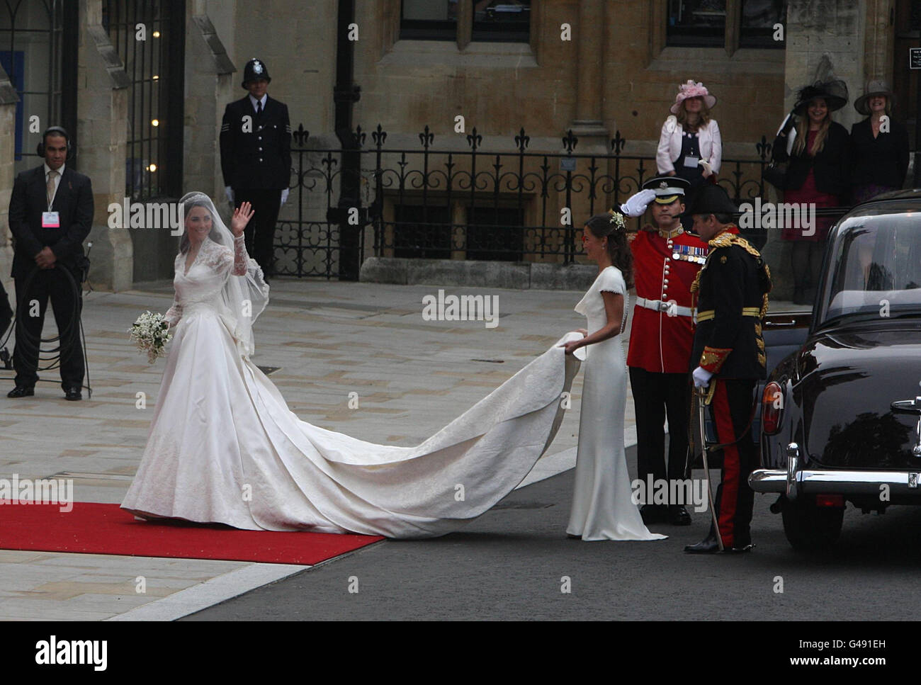 Kate Middleton waves as she arrives at Westminster Abbey where she is ...