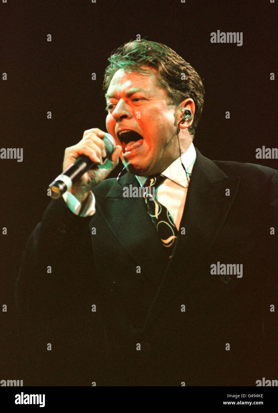 Celebrity performing singing on stage microphone robert palmer hi-res ...