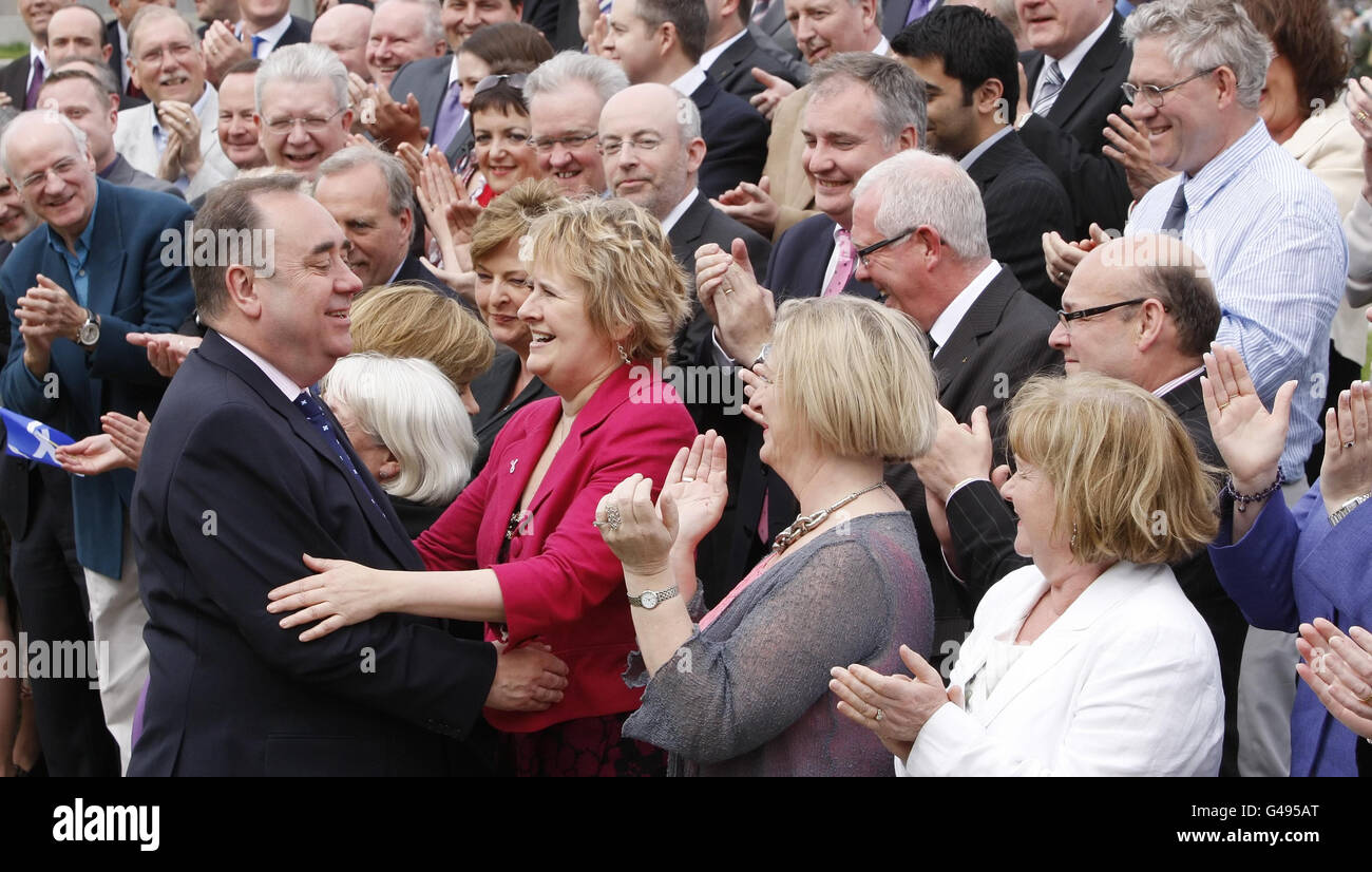 SNP leader Alex Salmond is greeted by newly elected SNP MSPs outside ...