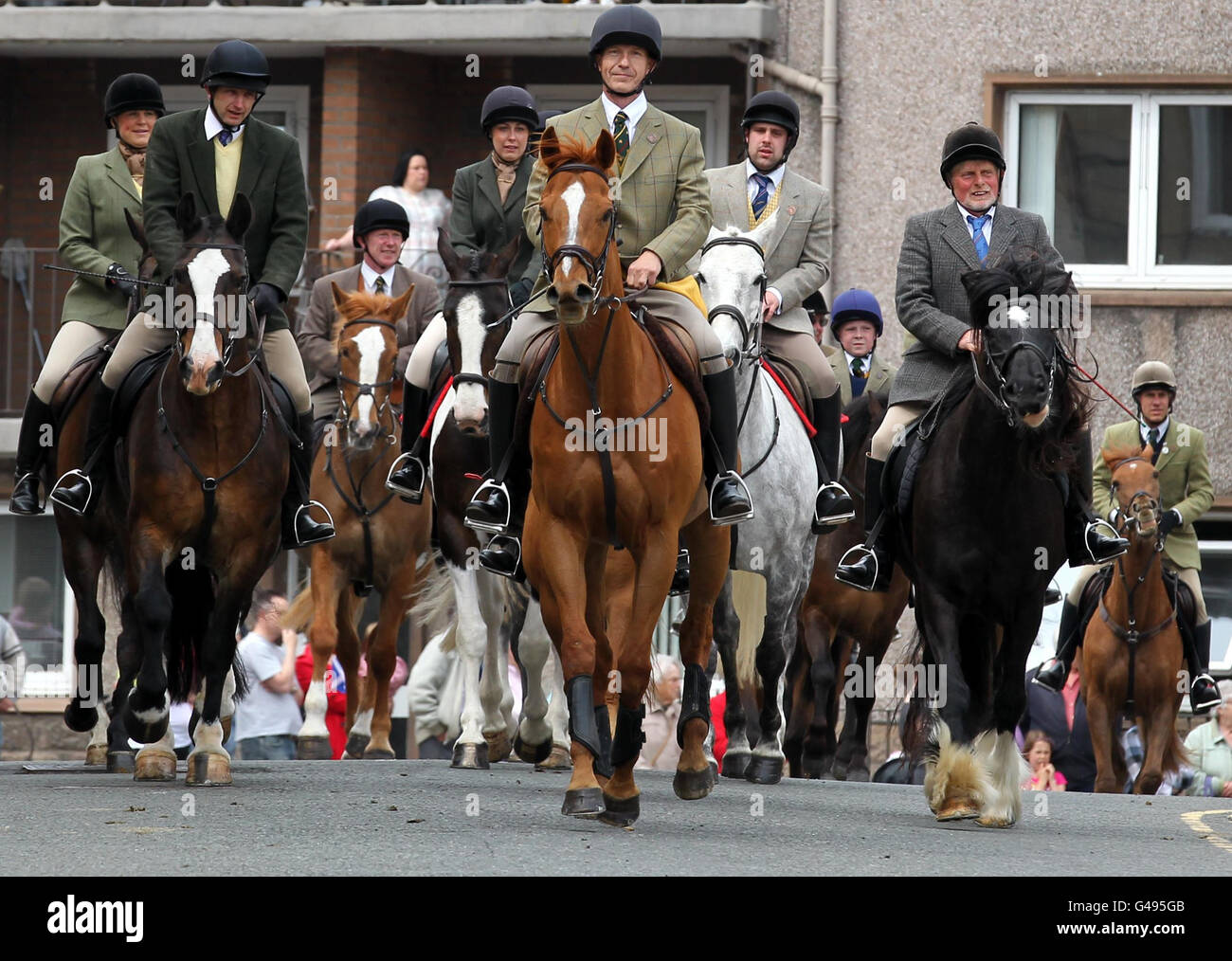 Horses and their riders go through the streets of Hawick on the first ...