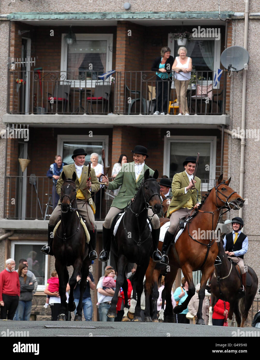Horses and their riders go through the streets of Hawick on the first ...