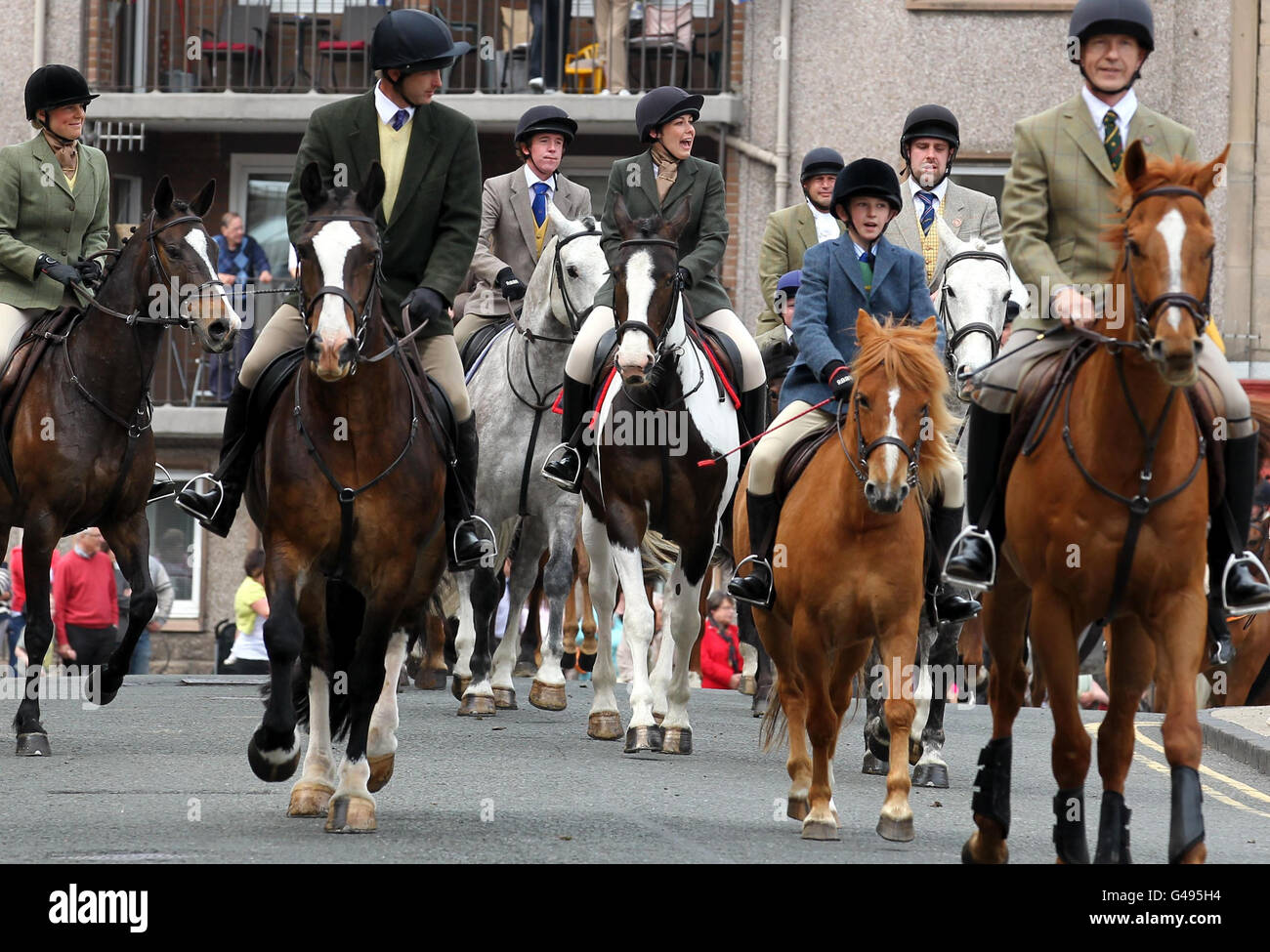 Horses and their riders go through the streets of Hawick on the first ...