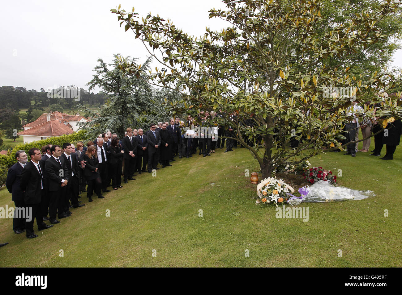 Ballesteros family members and close friend gather around the urn ...