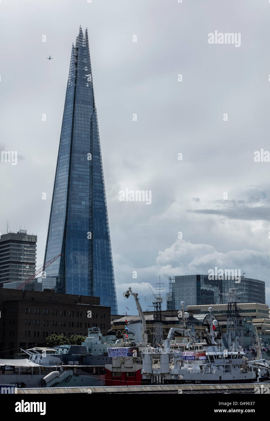 Fishing trawlers parked next to the HMS Belfast and in front of The ...