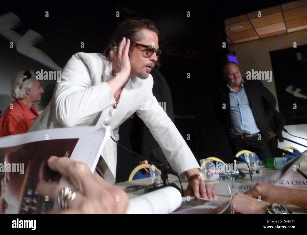 Fashion for Relief Catwalk - Cannes. Brad Pitt signs autographs after a ...