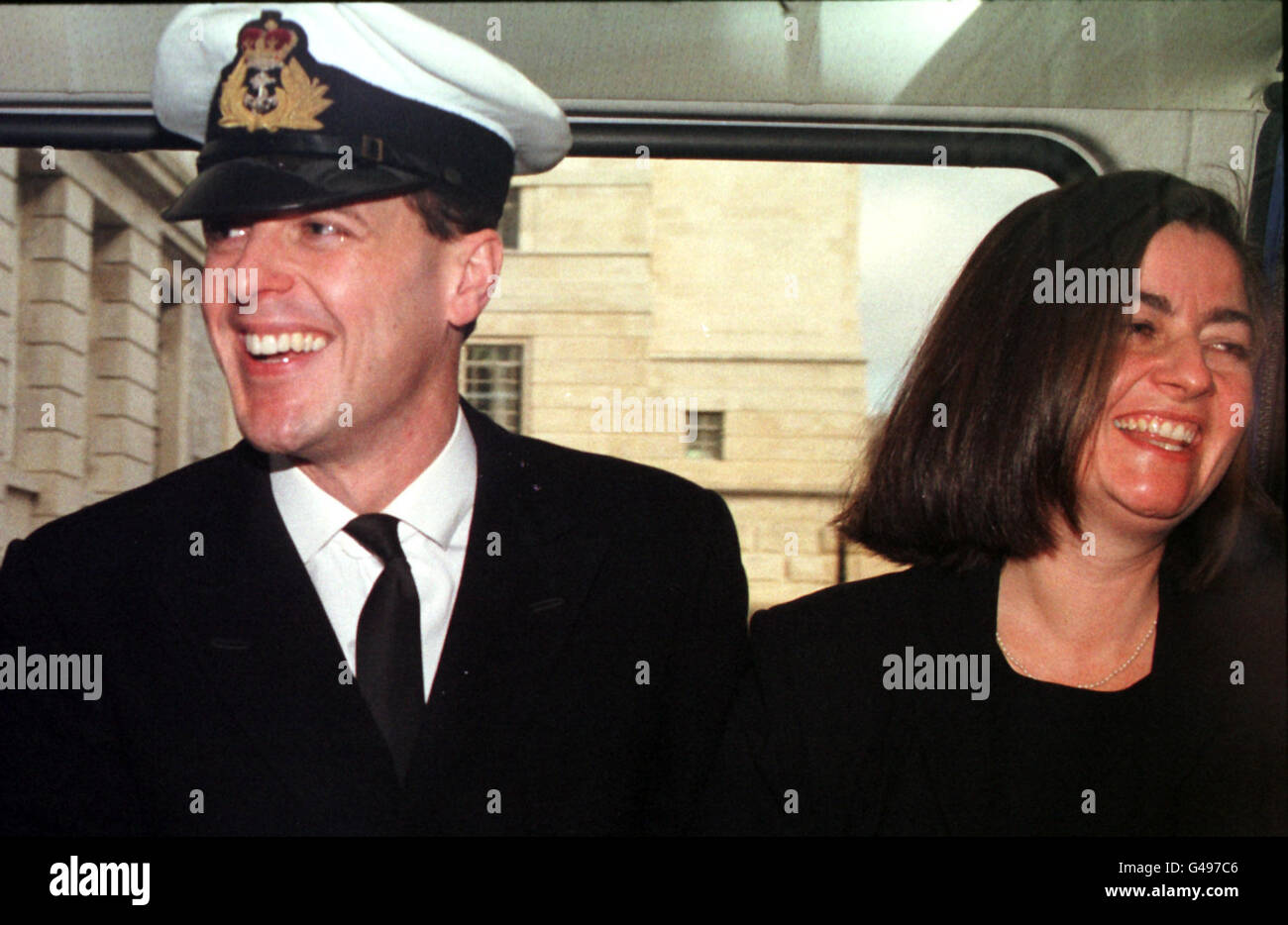 Lieutenant Commander David Bellingham, 31, is driven away with his wife ...