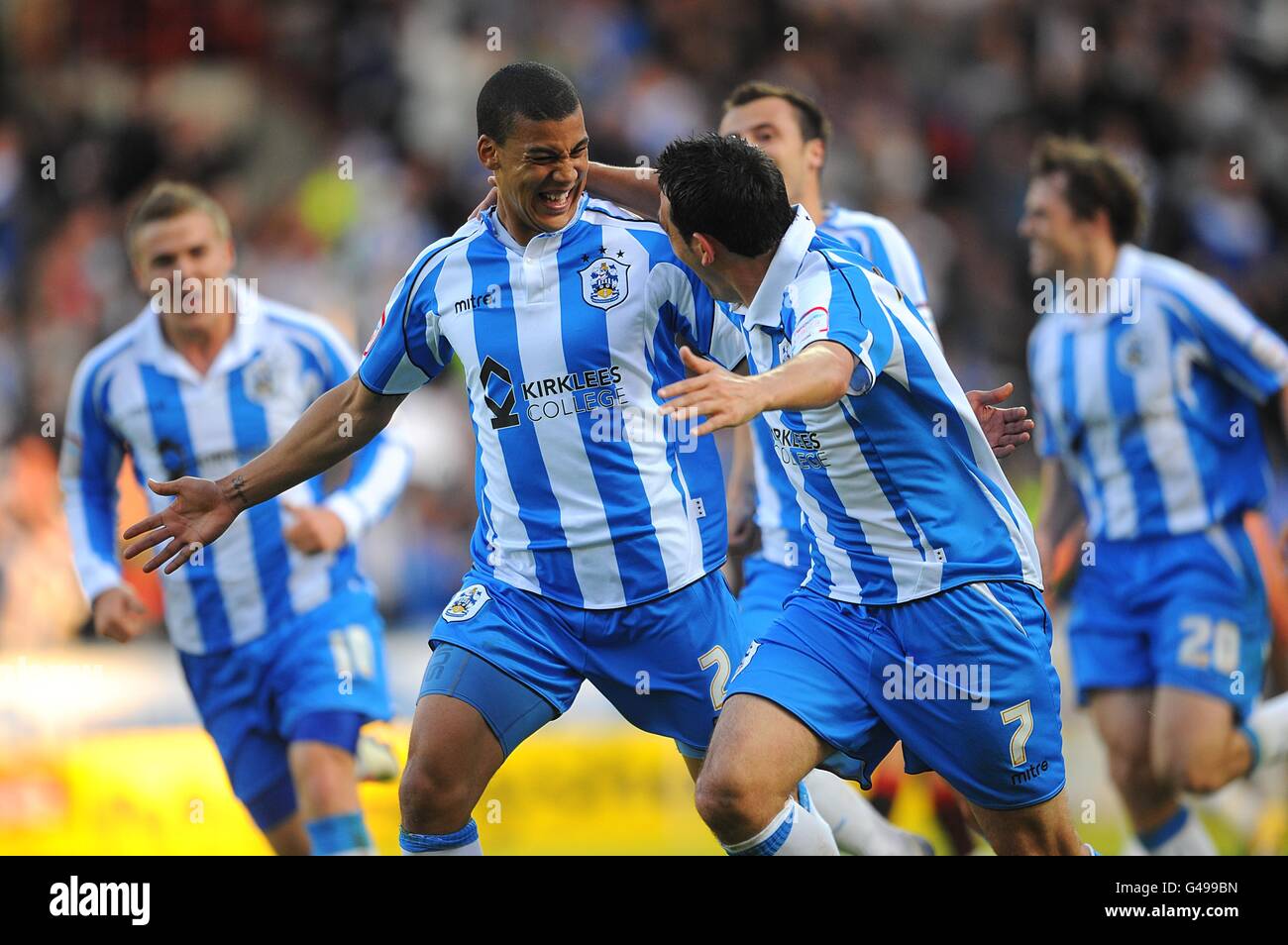 Huddersfield Town's Lee Peltier (2ns left) celebrates with his team ...