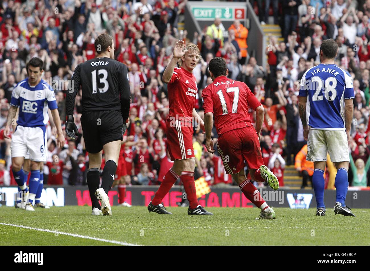 Liverpool's Dirk Kuyt (centre) waits to congratulate team-mate ...