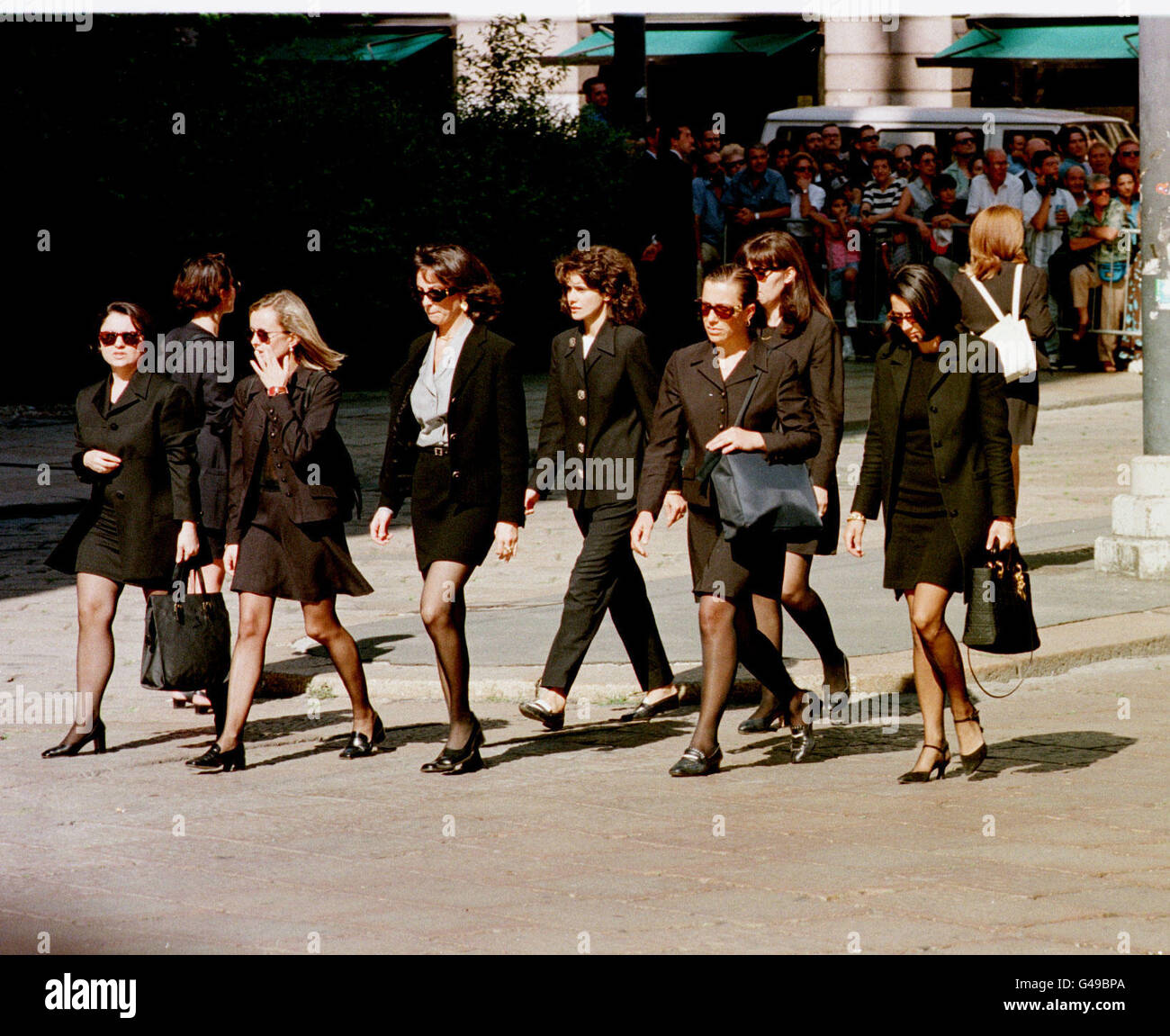 Mourners gather for the memorial service for the murdered fashion ...