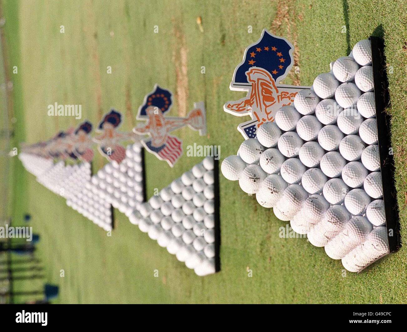 Pyramids of golf balls ready on the practice area for the players of ...