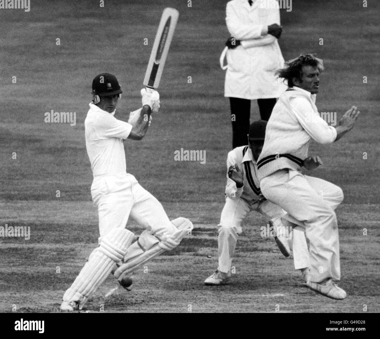 Middlesex midfielder Clive Radley jumps out of the way as Keith ...