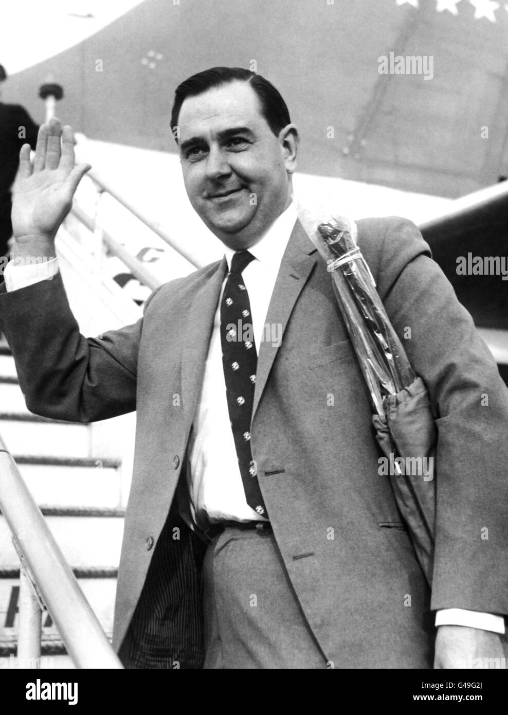 Captain colin cowdrey waves as he boards the aircraft hi-res stock ...