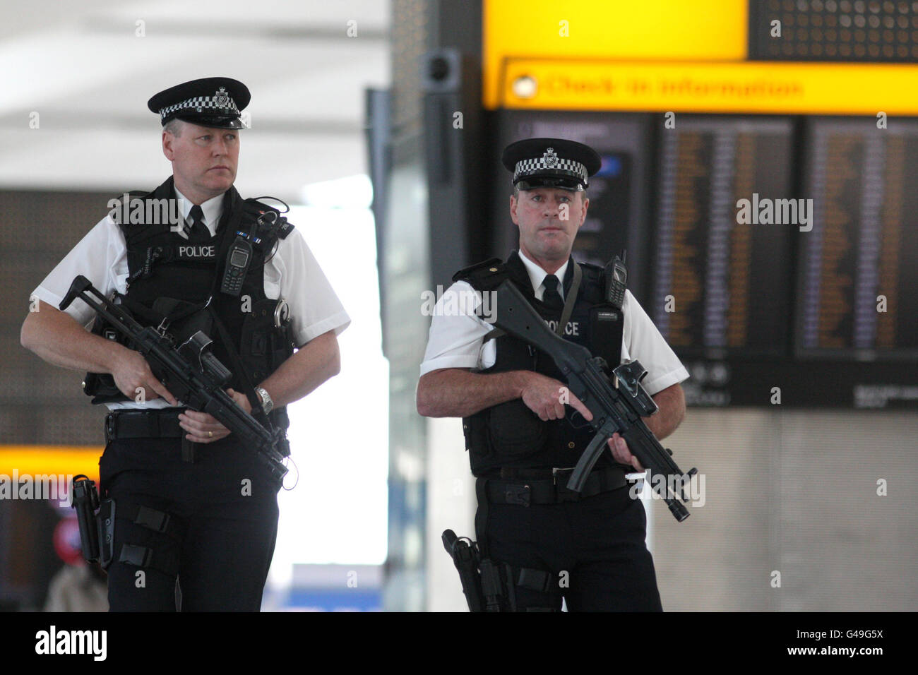 Police officers patrol heathrow airport hi-res stock photography and ...