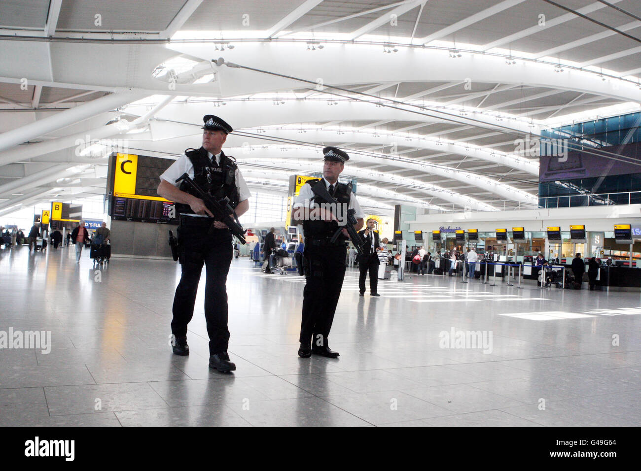 Police officers patrol heathrow airport hi-res stock photography and ...