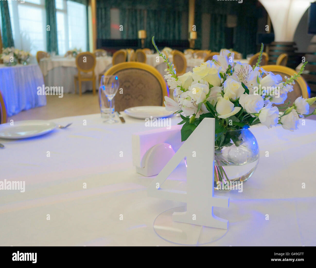 Tables decorated with flowers Stock Photo - Alamy