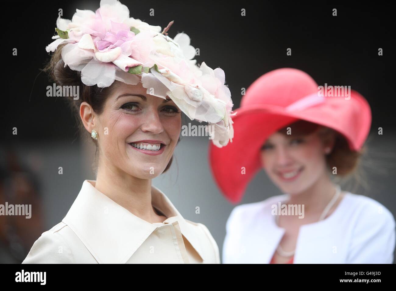 A Lady celebrates winning best dressed during the races at Punchestown ...
