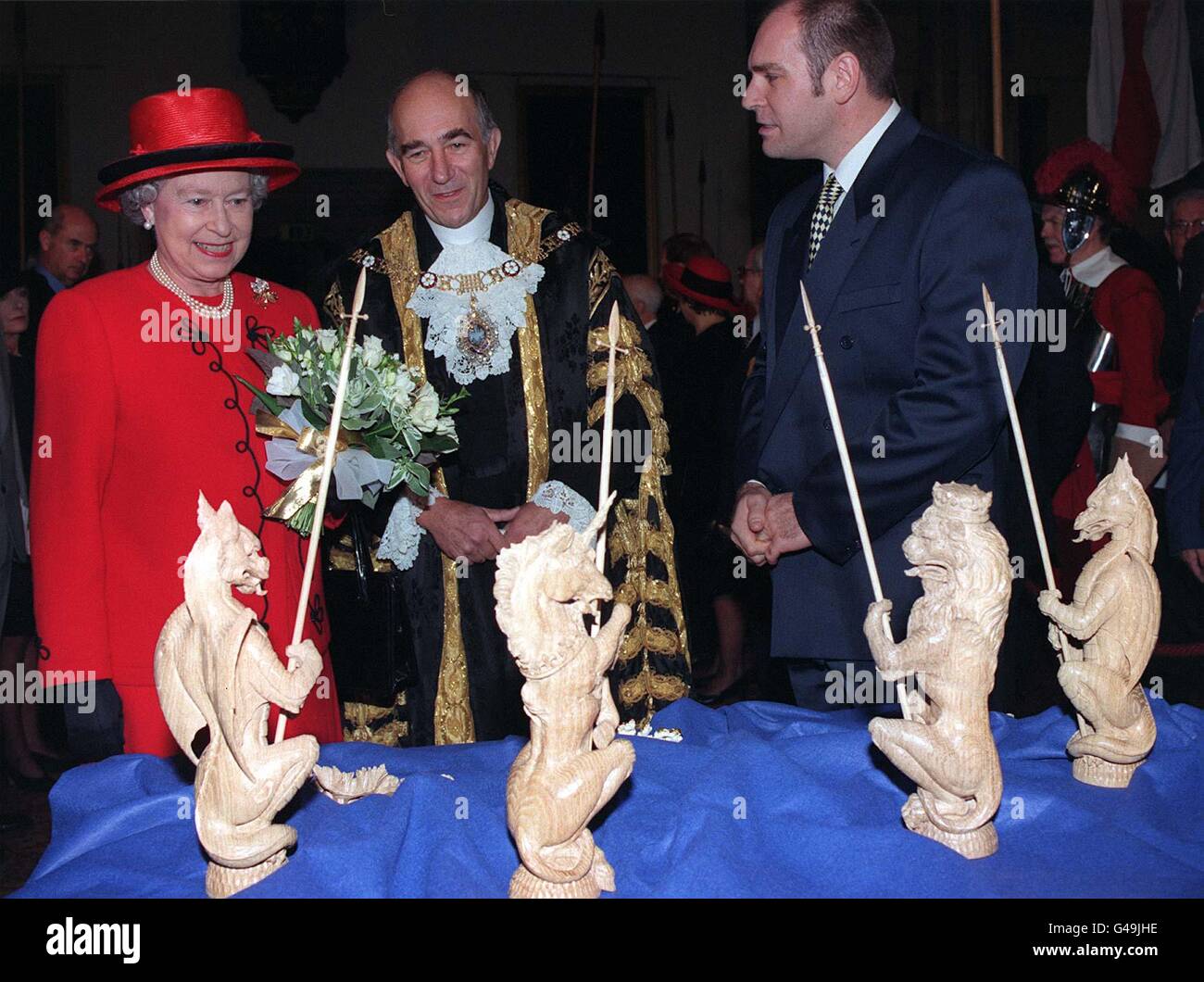 The Queen talks to the Lord Mayor of London and Ben Harms, one of the ...