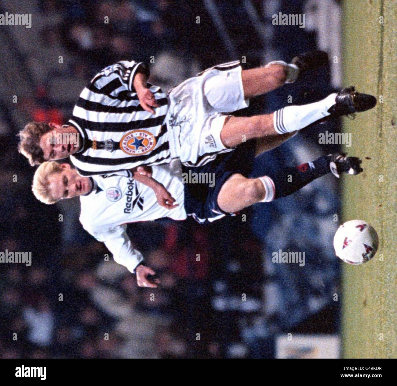 Bolton Per Frandsen chases after Newcastle's Jon Dahl Tommmasson during ...