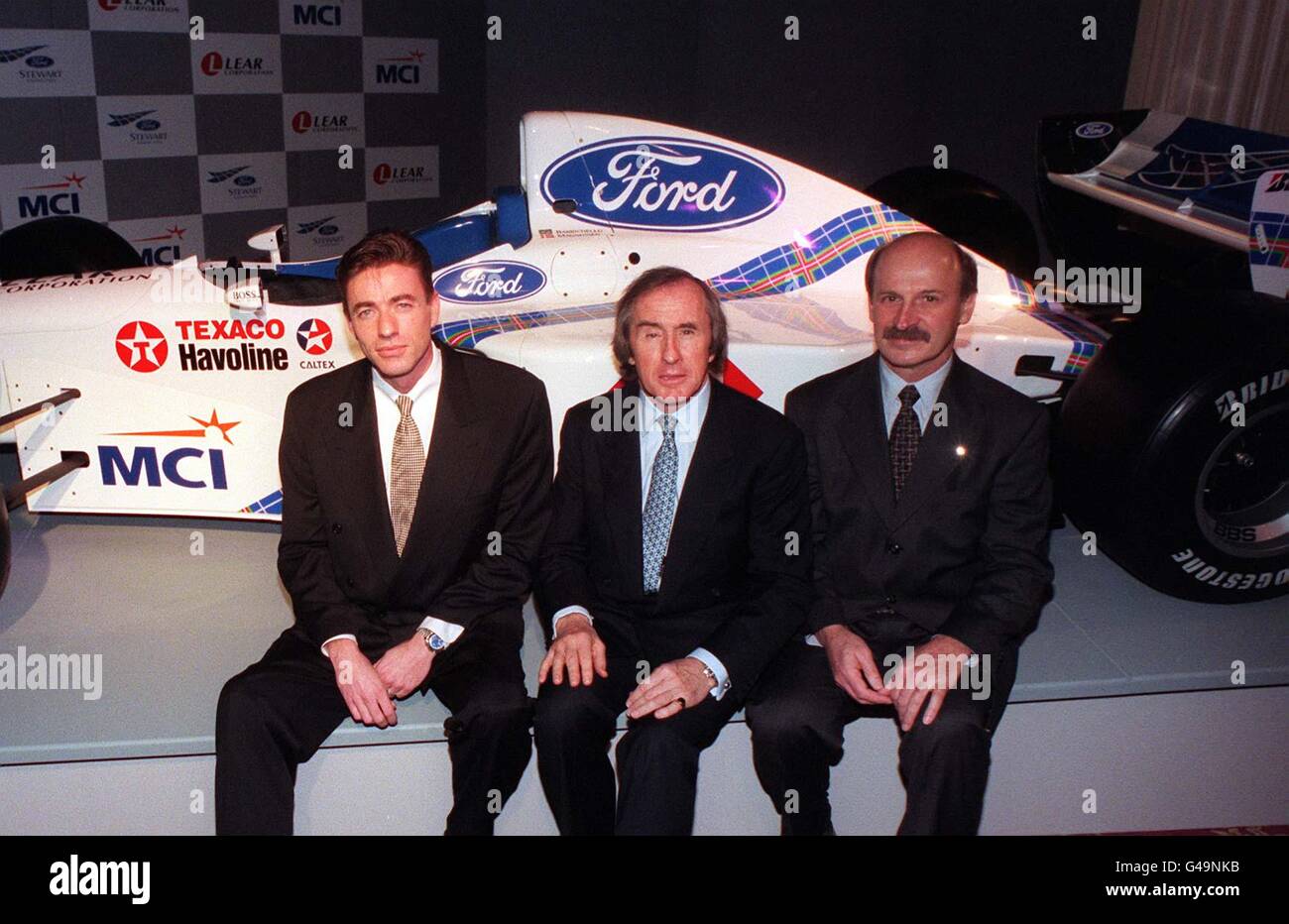 Jackie Stewart (centre), chairman of Stewart Grand Prix, unveils two ...
