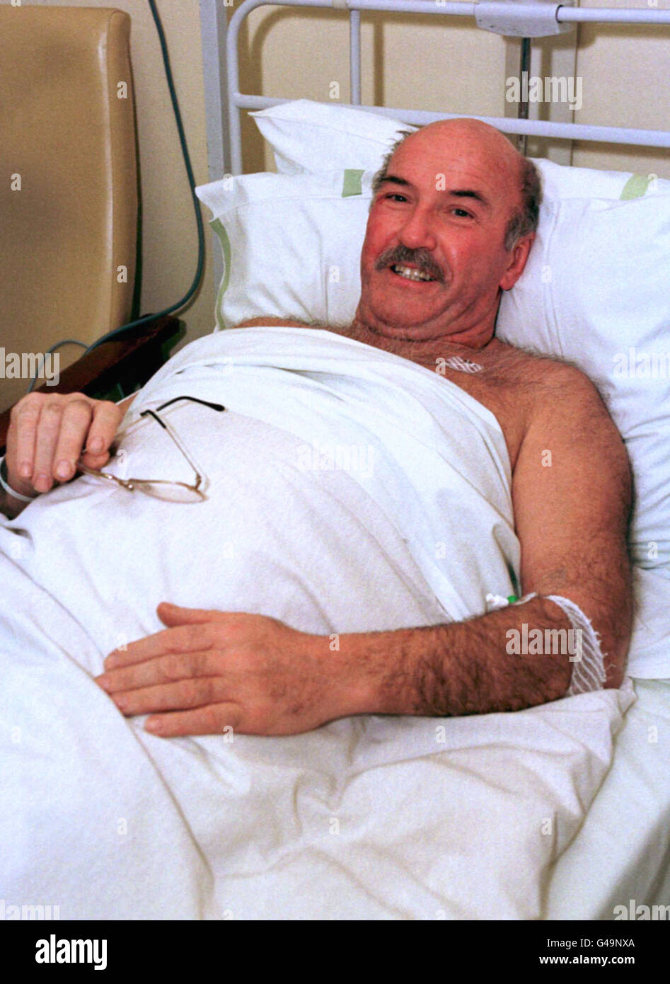 Businessman Bren Jones sits up from his bed in Lincoln Hospital to pose ...